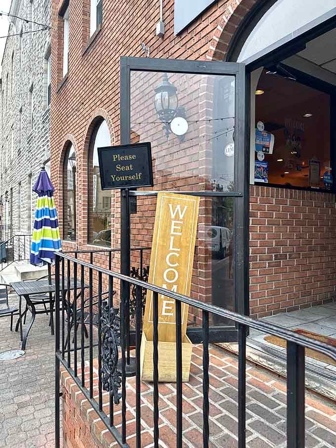 That welcoming entrance promises good things ahead, and the "Please Seat Yourself" sign means your breakfast adventure starts immediately inside.