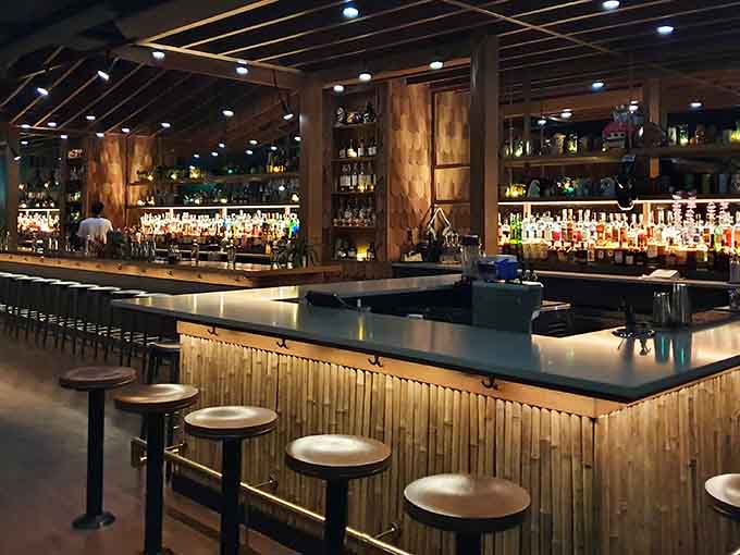 A bar stocked like a rum museum, where every bottle represents another potential journey to island bliss.
