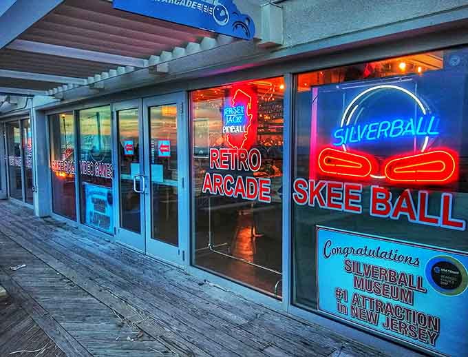 Neon signs beckon from the boardwalk, promising an escape into gaming history just steps from the Atlantic Ocean.