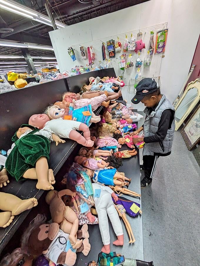 Dolls lined up in slightly unsettling rows, ready to delight children or possibly star in a quirky horror film.