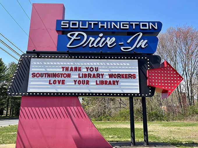 That retro marquee with its pink arrow and classic script font practically begs you to honk twice for nostalgia.