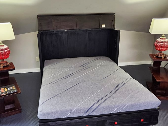 The bedroom proves you can sleep comfortably while technically residing inside a flying saucer, gravity included free of charge.