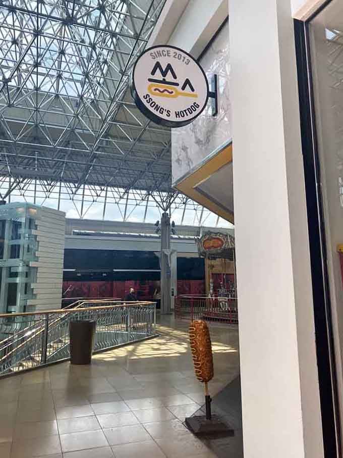 The storefront sign beckons from the mall corridor, promising Korean street food adventures just steps away from your usual shopping routine.