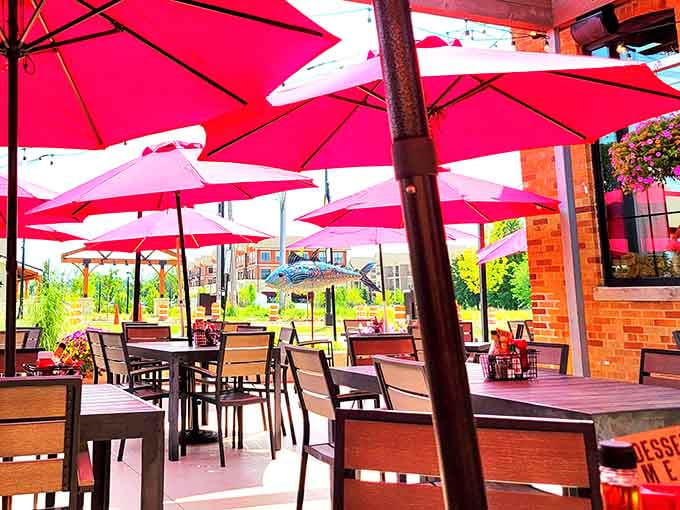 Bright umbrellas shade outdoor tables where warm-weather dining feels like a mini escape to sunnier coastal destinations.