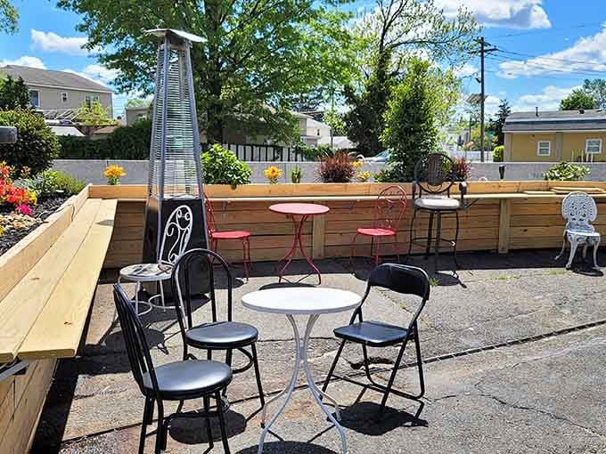 Outdoor seating with planters full of flowers makes eating a burger feel like a proper garden party experience.