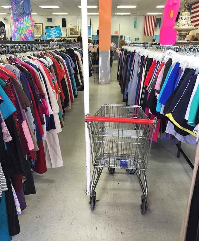 That empty cart waits patiently in the aisle, ready to become your twenty-five dollar shopping adventure vehicle.