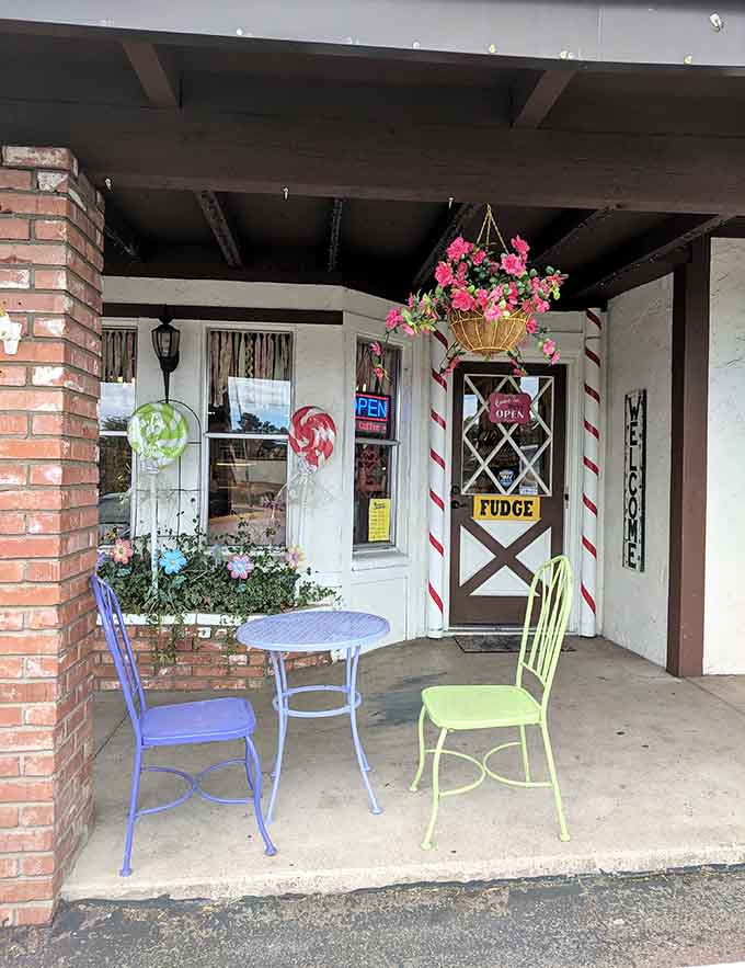 Outdoor seating with colorful chairs invites you to sit, relax, and enjoy your fudge in the fresh pine air.