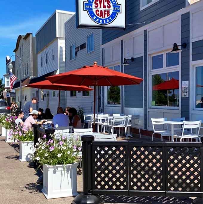 Sidewalk seating under bright umbrellas lets you savor your meal while watching small-town life unfold.