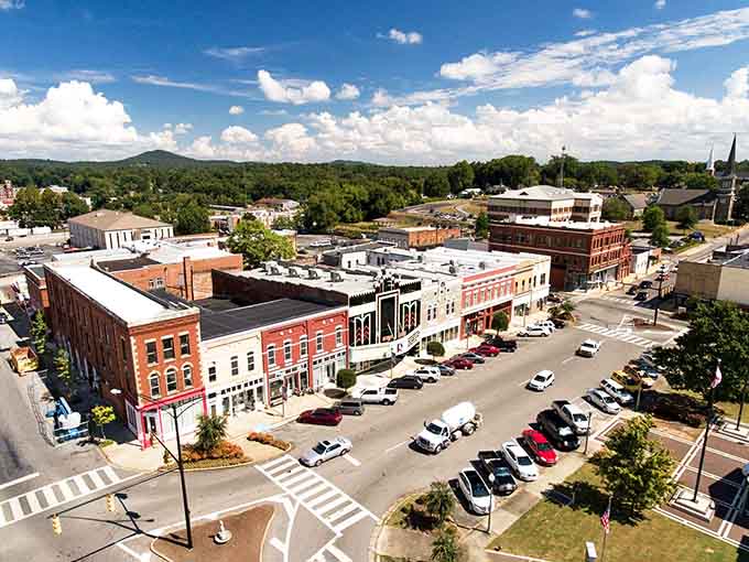 Aerial views reveal a compact, walkable downtown surrounded by green spaces and genuine Southern hospitality.