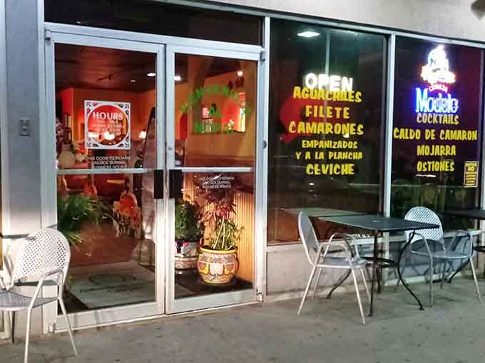 The exterior at night, glowing with promise and the kind of authentic food that makes road trips worthwhile.