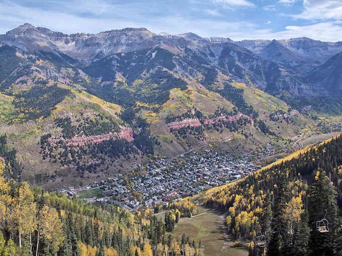 From above, Telluride nestles in its box canyon like nature's own jewelry box, mountains standing guard on all sides.