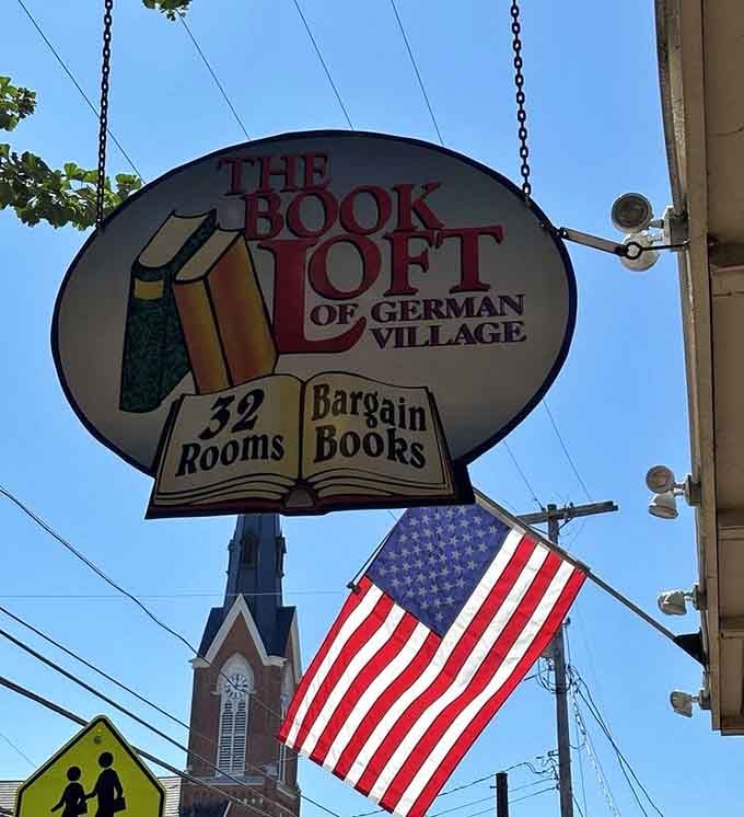 That vintage sign swinging proudly announces 32 rooms of bargain books, your wallet's favorite warning.