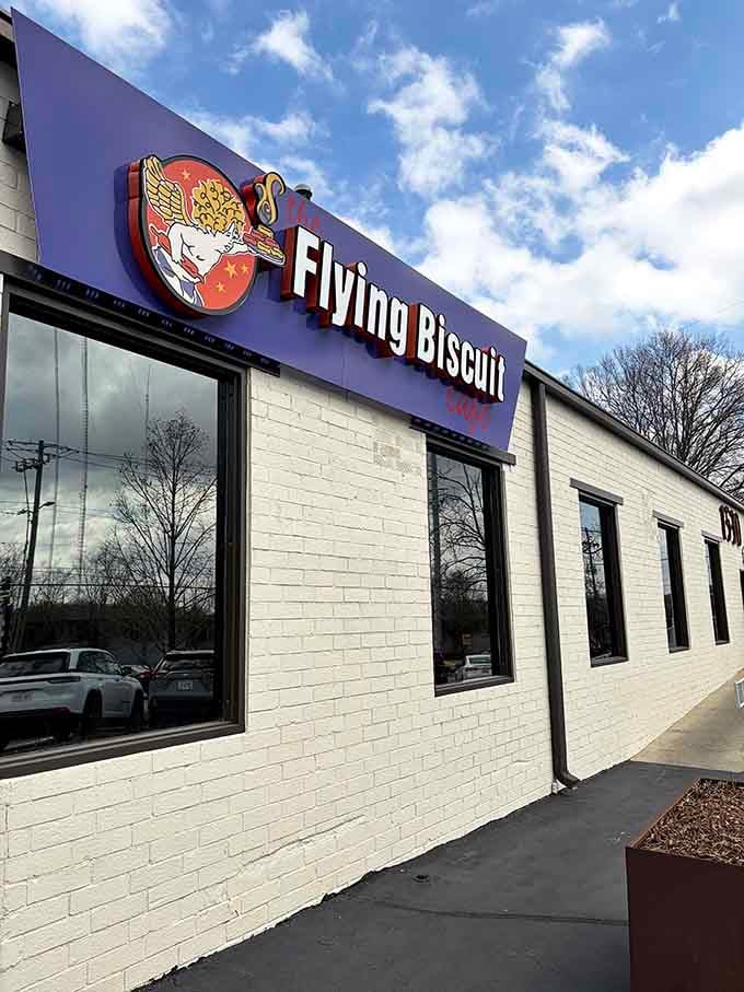 Clean white brick exterior with bold purple signage makes finding your breakfast destination easier than parallel parking downtown.
