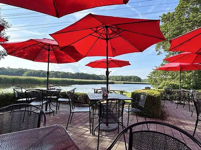 Red umbrellas and waterfront views make outdoor dining here feel like a mini vacation every time.