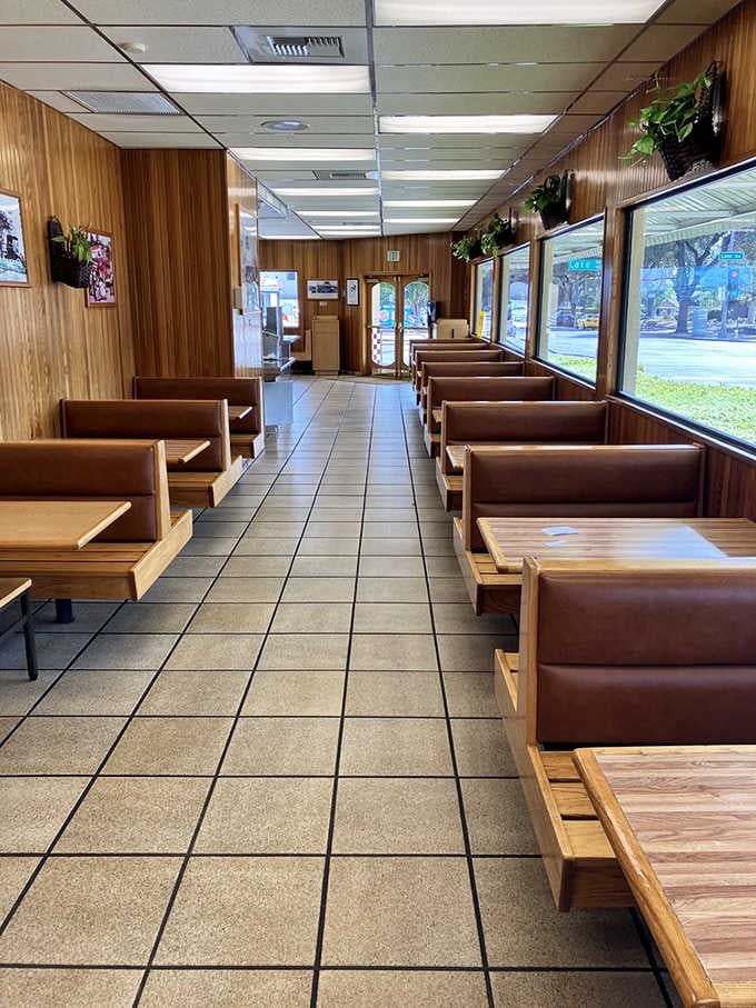 Rows of booths await hungry diners, each one a front-row seat to the greatest sandwich show around.