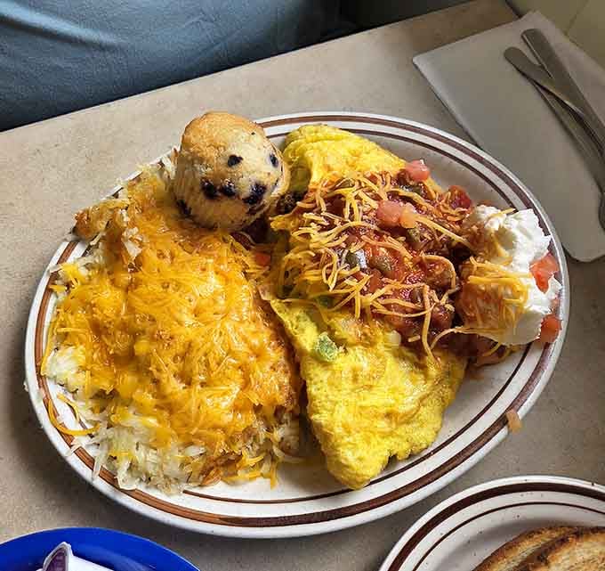 This breakfast platter doesn't mess around, delivering eggs, hash browns, and a muffin like edible insurance against hunger.