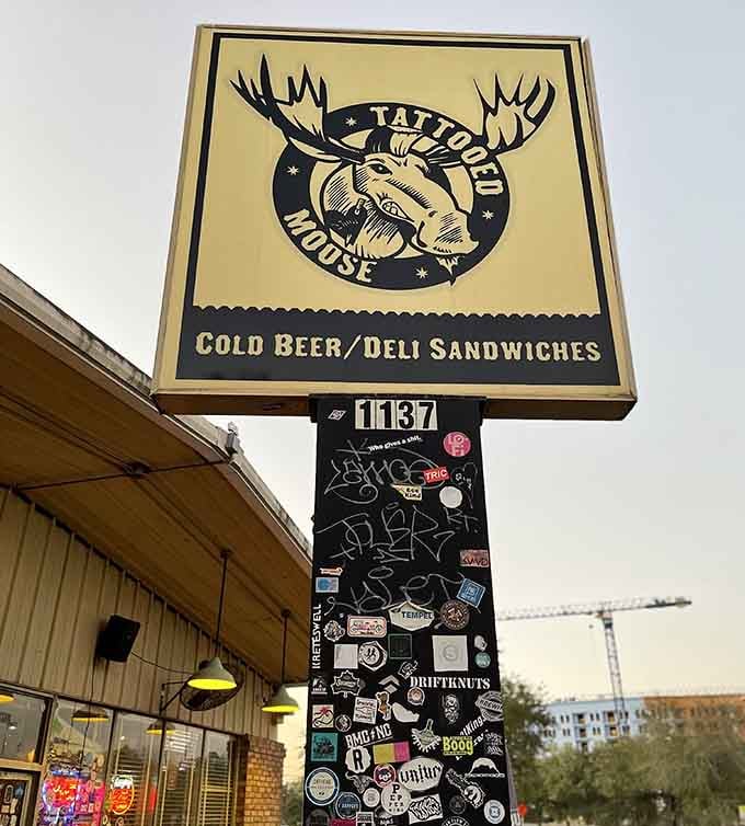 The sign says it all: cold beer and deli sandwiches, the two things every great neighborhood spot needs.
