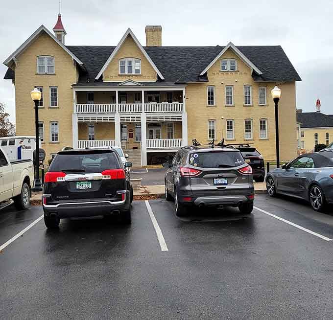 Even the parking lot can't diminish those Victorian facades – proof that great bones never go out of style.