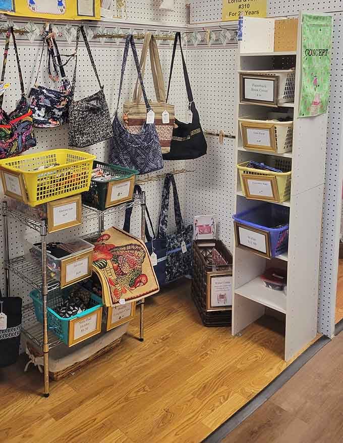 Handmade bags hanging like fabric sculptures, proving that functional accessories can absolutely double as artistic expressions.