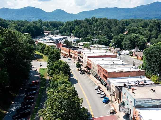 Aerial views reveal a compact downtown surrounded by endless green, proving size doesn't determine charm.