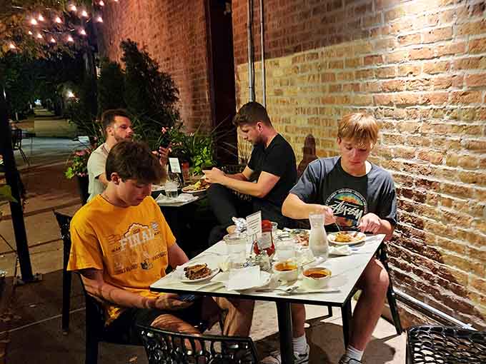 Outdoor dining on a Chicago evening, where brick walls and good food create memories worth repeating often.