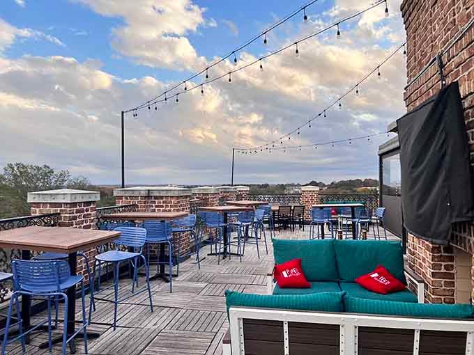 String lights and comfortable seating make this rooftop feel like someone's really great backyard, elevated several stories.