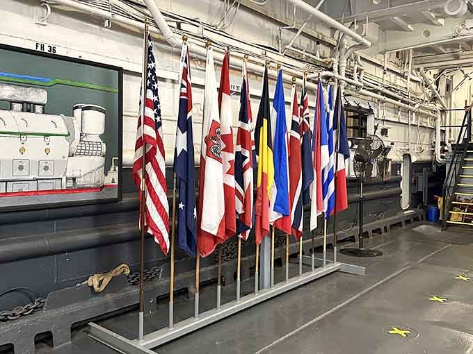 Allied flags stand together in the tank deck, representing nations united against tyranny eight decades ago strong.