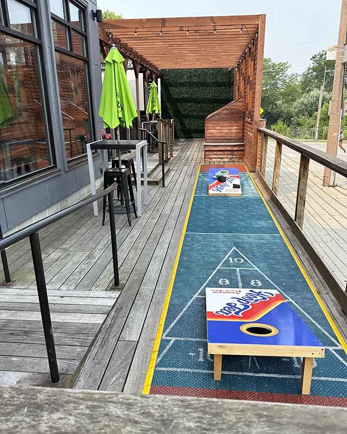 The outdoor patio extends the fun into fresh air, complete with cornhole for when you need a break.
