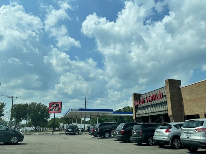 The exterior view where countless treasure hunters gather, their cars parked in anticipation of retail adventure ahead.