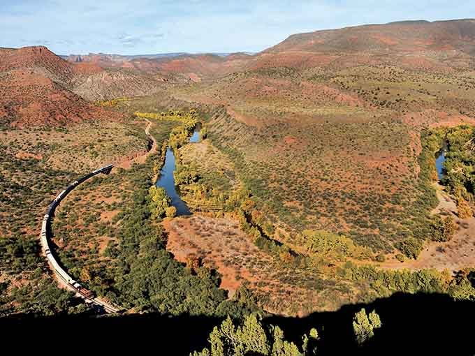 From above, you can see how the train follows the river's curves through this spectacular Arizona canyon.