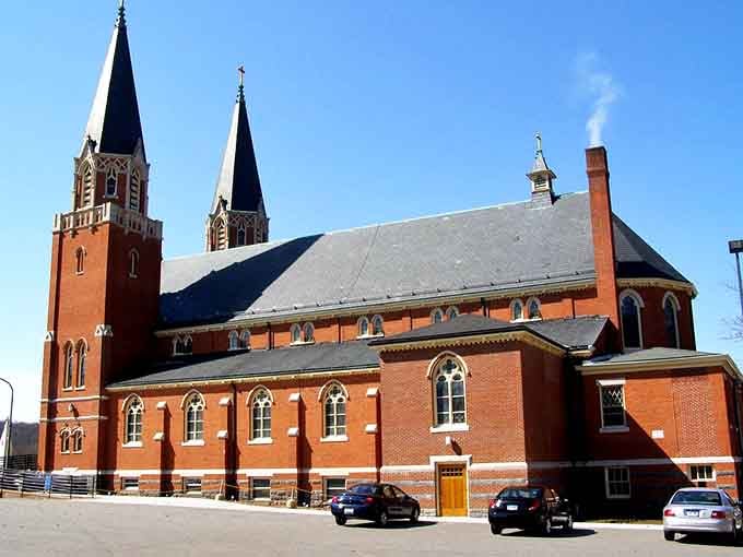 Saint Bernard Church's twin spires reach skyward with the kind of architectural grace that makes you pause mid-errand.