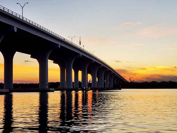 Sunset paints the bridge in golden hues, nature's nightly reminder that some shows never get old.