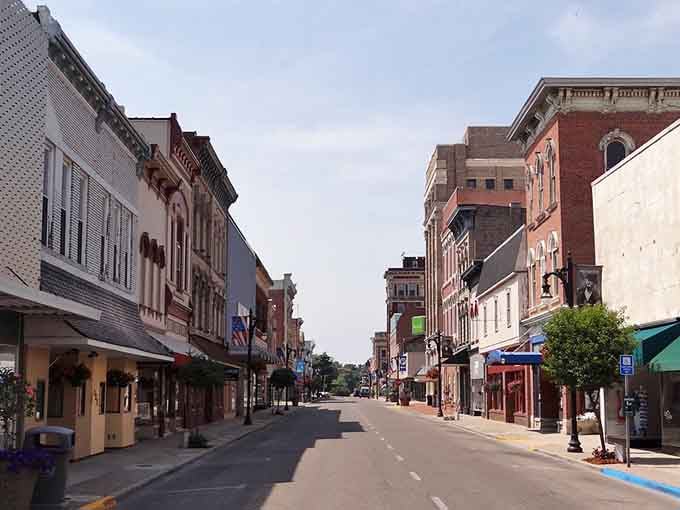 Brick buildings stand shoulder to shoulder like old friends who've weathered every storm together for two centuries.
