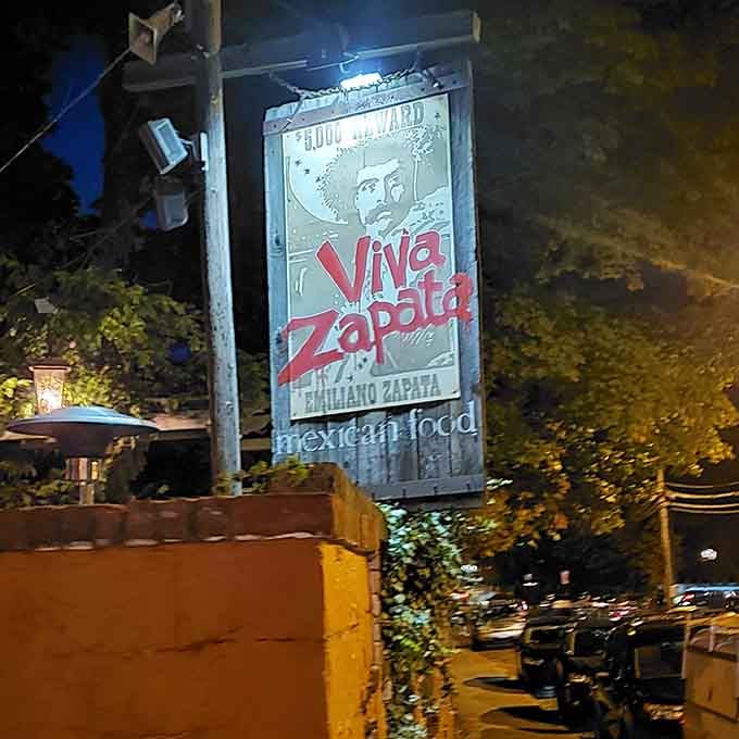 That illuminated sign glowing against the night sky is basically a beacon calling all taco lovers home to paradise.