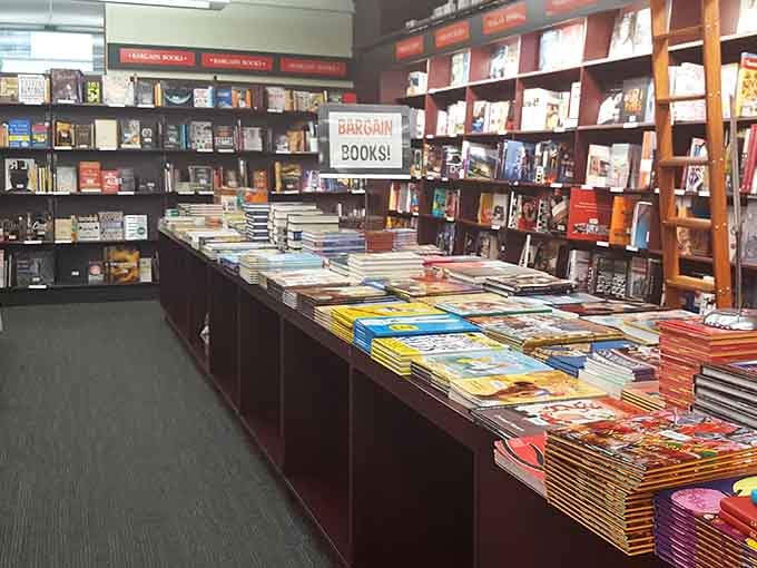 Bargain books stacked high because even discounted literature deserves respect and a good home.