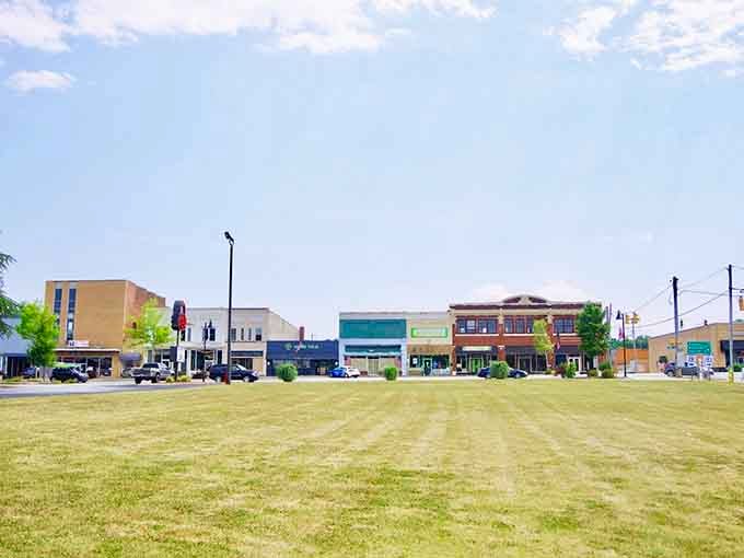 The town green provides space for festivals, relaxation, and watching clouds drift over mountain peaks.