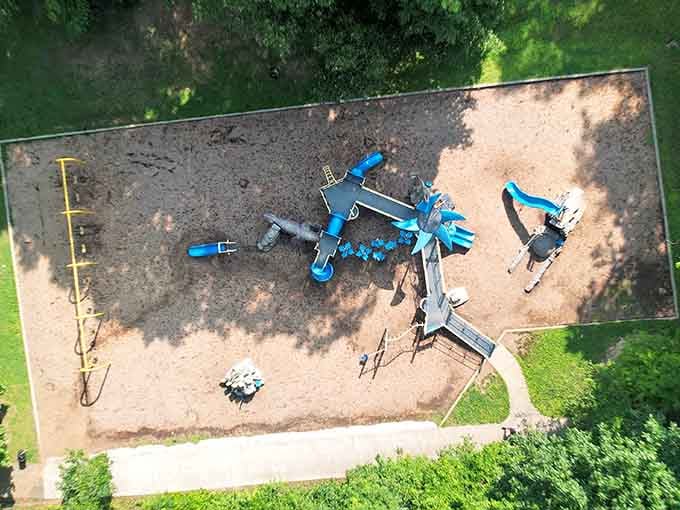 The bird's-eye view reveals how thoughtfully everything connects, creating pathways for adventure in every shaded corner of this playground.