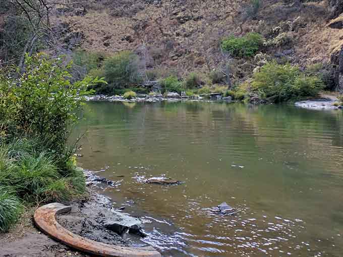 The river below the falls offers tranquil spots perfect for contemplating nature's patient, persistent artistry.