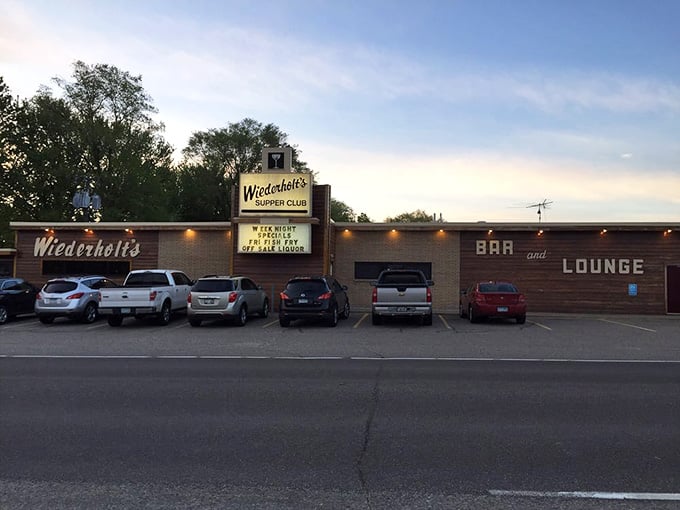 The full parking lot at dusk tells you everything: locals know this place delivers consistently excellent experiences.