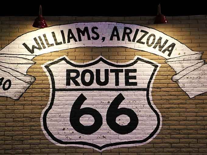 Williams proudly displays its Route 66 heritage on brick walls, celebrating the Mother Road with well-earned pride.