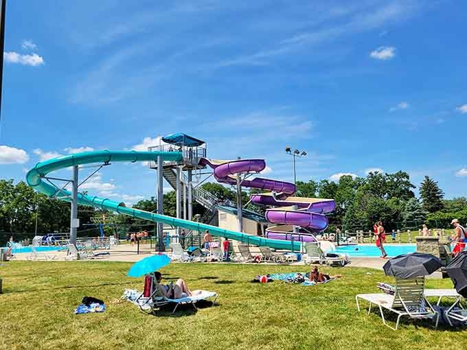 Water slides in purple and teal because Emricson Park understands that summer fun requires commitment to the bit.