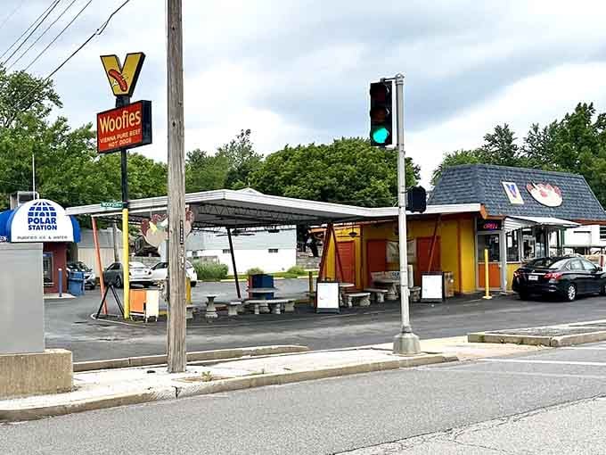 That vintage sign has been guiding hungry travelers to hot dog paradise since the disco era, bless it.