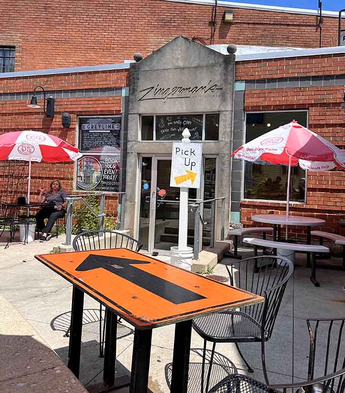 Patio dining at Zingerman's Delicatessen means enjoying your sandwich al fresco under cheerful red umbrellas.