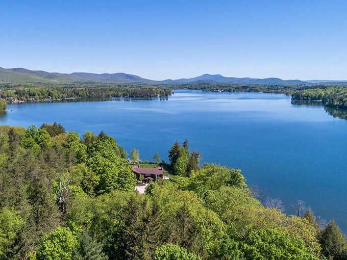 Aerial views reveal this lake's perfect blue nestled among rolling hills like a sapphire jewel.