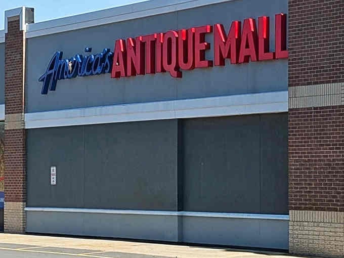 That bold red lettering against brick practically shouts "treasures inside" louder than your neighbor's garage sale megaphone.