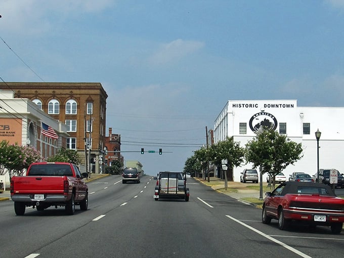 Historic downtown Americus stretches wide under blue skies, where brick buildings whisper stories of affordable Southern living.