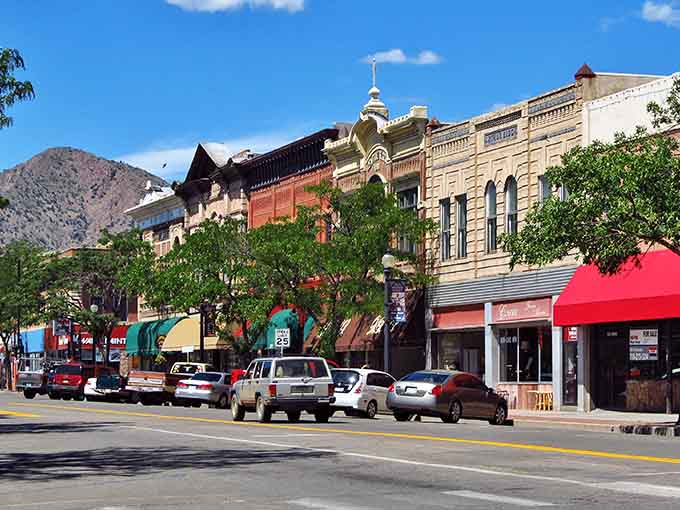 Historic storefronts line Main Street where mountains peek between buildings like nosy neighbors checking out the view.