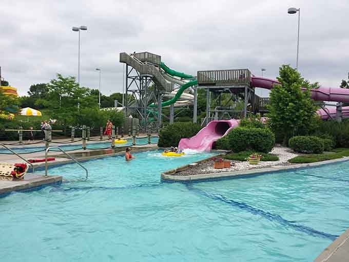That bold pink slide delivering pure joy straight into Cascade Bay's sparkling turquoise pool is pure summer magic.