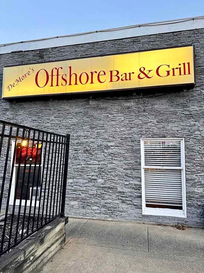 That bold yellow sign against sleek stone tells you everything: fresh seafood awaits behind this modern downtown entrance.