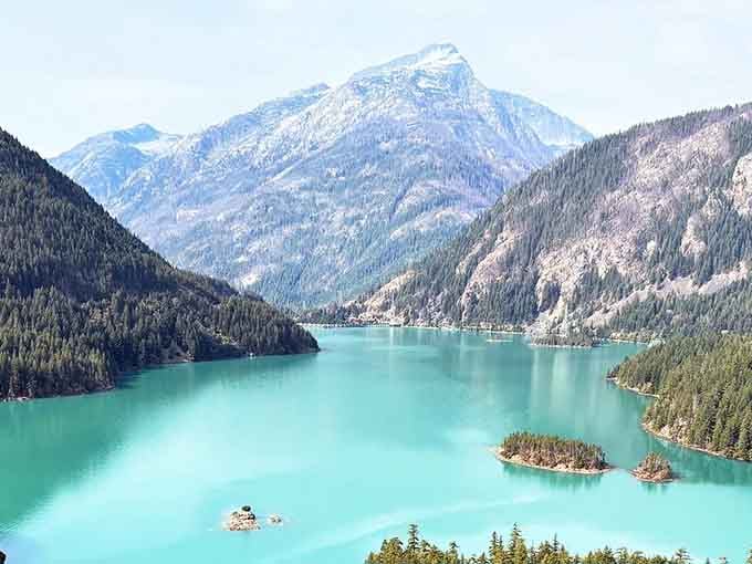 That turquoise water looks like Mother Nature spilled her favorite paint color all over the mountains.